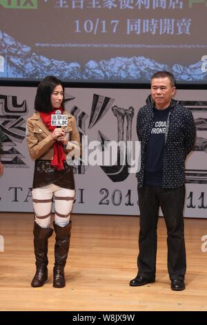 Director Chen Yu-hsun, left, and his team members hold their award for ...