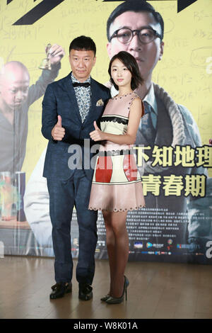 Chinese actor Sun Honglei, left, and actress Chen Hong pose at the red ...