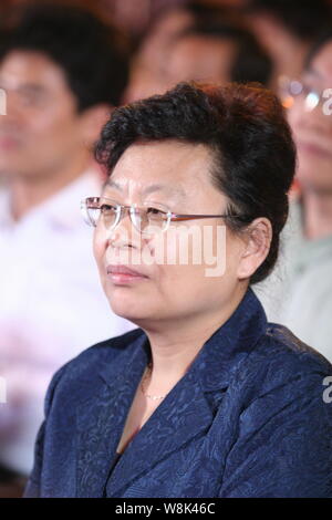 --FILE--Lv Xiwen, then member of the standing committee, applauds at ...