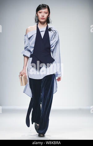 A model displays a new creation at the MAKEMAKE fashion show during the ...