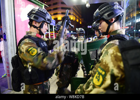 --FILE--Chinese paramilitary policemen patrol the Tian'anmen Square in ...