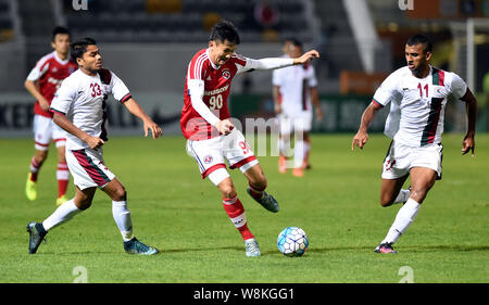 Pronay Halder of India's Mohun Bagan, right, challenges Chan Siu-kwan ...