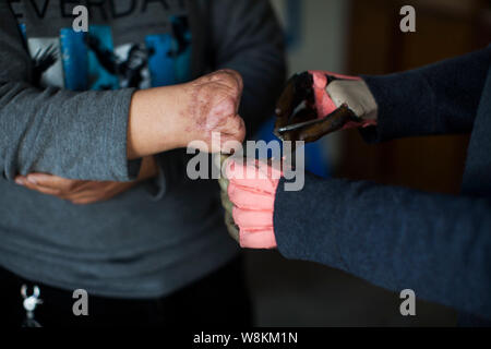 63-year-old armless farmer Sun Jifa who is equipped with his homemade ...