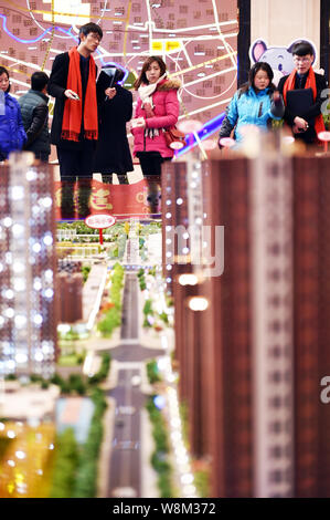 --FILE--Chinese homebuyers look at housing models of a residential ...