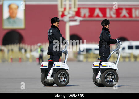 --FILE--Chinese police officers patrol the Beijing West Railway Station ...