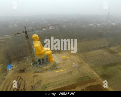 Golden statue of Chairman mao zedong on white background Stock Photo ...