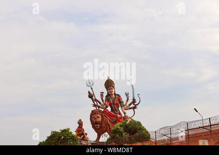 The giant statue of Durga at the Hindu temple Ganga Talao, Grand Bassin ...