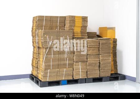 Stacked of flat pack cardboard boxes on pallet for product packaging ...
