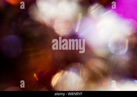 Smooth colorful specks of bright light shining on dark background Stock ...