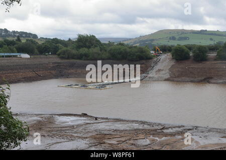 Pumping out water from Toddbrook Reservoir above Whaley Bridge in ...