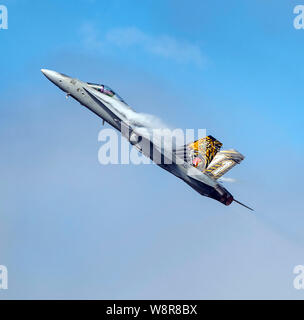With afterburner lit, an F/A-18C Hornet pilot awaits the signal to ...