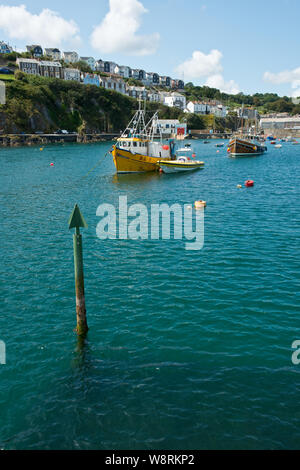 Inshore fishing boats in outer harbour. Mevagissey, Cornwall, England ...