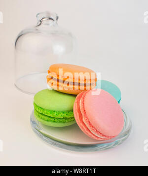 Blue colored french biscuits on yellow background Stock Photo - Alamy