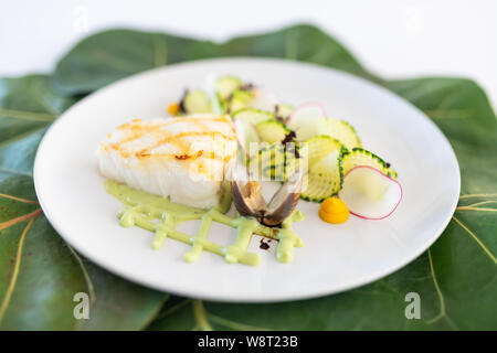 A beautiful, well presented food course on a white table Stock Photo ...