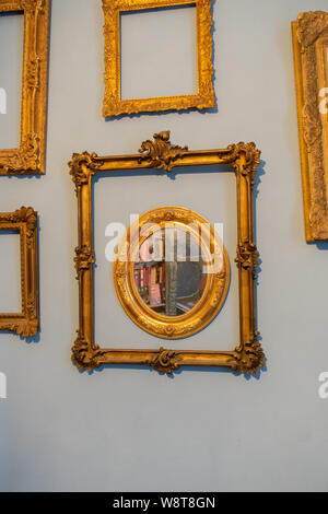 Old Gold Picture Frames on wooden wall Stock Photo - Alamy