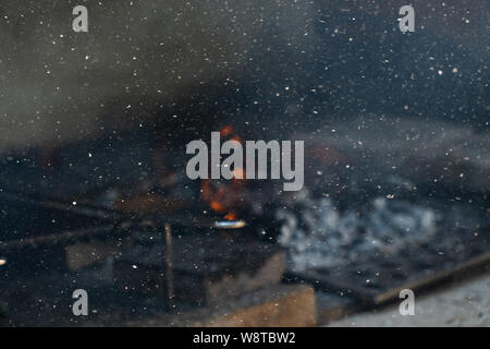 fire in a barbaque, setting fire on coal barbacue Stock Photo - Alamy