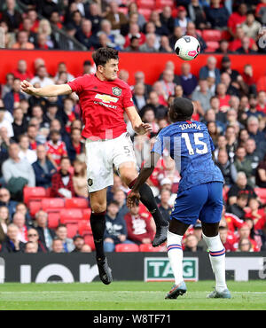Harry Maguire of Manchester United heads on goal and hits the crossbar ...