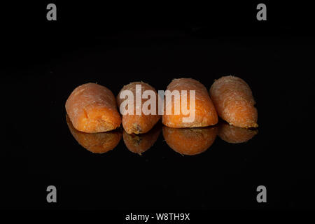 Group of four halves of stale orange stale baby carrot baby isolated on ...