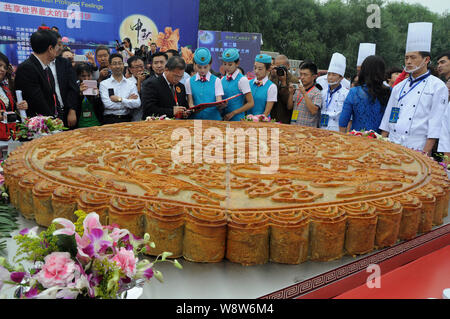An officer of the World Record Association checks the world's largest ...