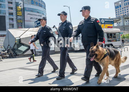 BEIJING, China - Armed police officers keep guard at Beijing's ...