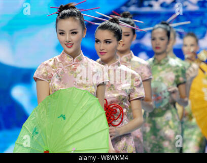 Chinese and foreign models display creations of cheongsam, also known ...