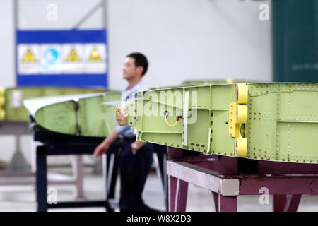 Horizontal stabilizers for the new Boeing 737 are lined up at the ...