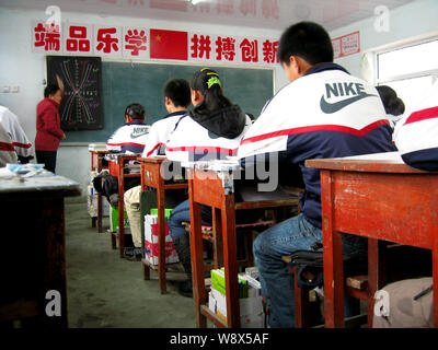 Students attend a mathematics class at a school in the southern village ...