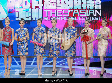 Chinese and foreign models display creations of cheongsam, also known ...
