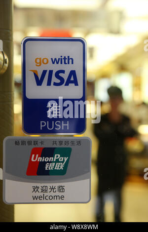 --FILE--Logos of China UnionPay, Visa and MasterCard are pictured at a ...