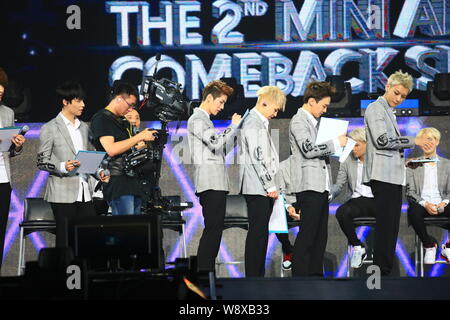 Members of South Korean-Chinese boy group EXO pose at their first ...