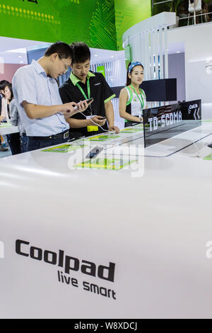 --File--Visitors are seen at the stand of Samsung during a fair in ...