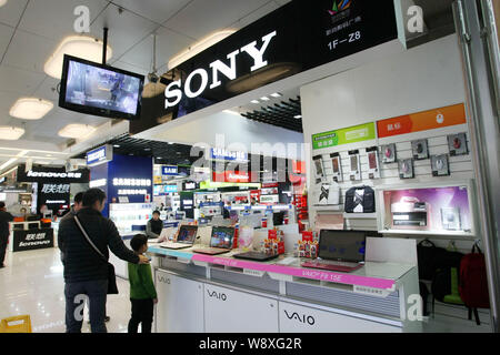 --FILE--Customers shop for laptop computers at a Media Markt store in ...