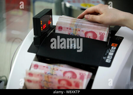clerk counting cash money at bank office Stock Photo - Alamy
