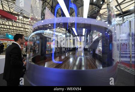 A model of a suspended monorail system is on display at the 2014 China ...