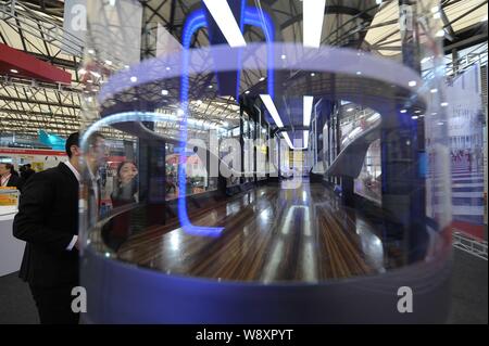 A model of a suspended monorail system is on display at the 2014 China ...