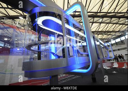 A model of a suspended monorail system is on display at the 2014 China ...