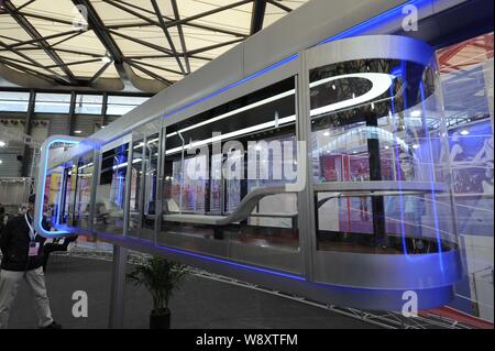 A model of a suspended monorail system is on display at the 2014 China ...