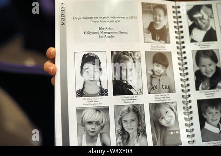 6-year-old Chinese child model Zhou Ziling shows the awards she won at ...