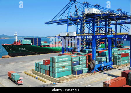 FILE - Shipping containers are stacked at a port in Tianjin, China ...