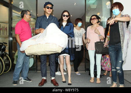 Hong Kong actor Danny Lau Dan, left, and his wife arrive at Hong Kong ...