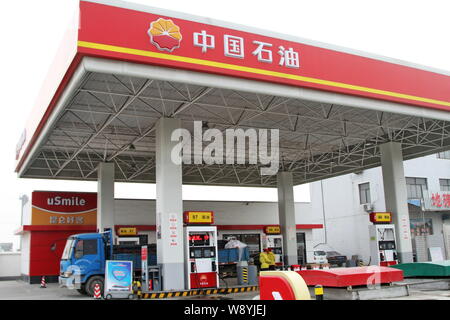 --FILE--A truck is being refueled at a gas station of CNPC (China ...