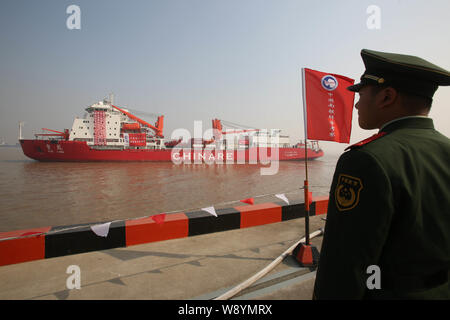 FILE - A police officer stands guard inside the St. Francis Catholic ...