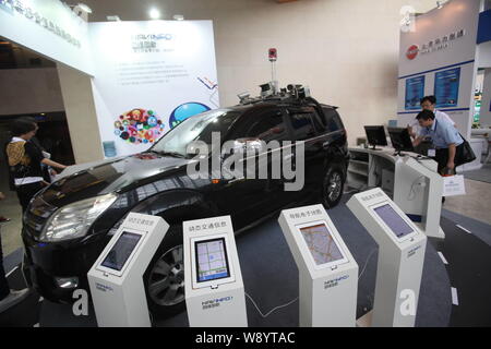 --FILE--People visit the stand of Chinese display panel maker BOE ...