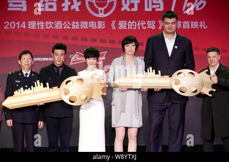 (From right) Retired Chinese basketball superstar Yao Ming and his wife ...