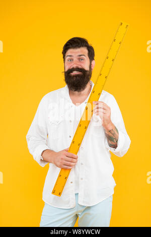 Big size. Measure and control. bearded man with ruler isolated on white ...