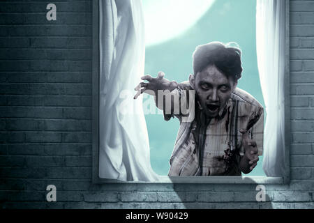 Scary zombies with blood and wound on his body haunted the abandoned ...