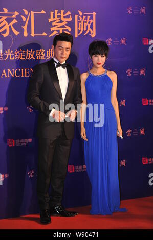 Chinese actor Lu Yi, left, and his actress wife Bao Lei attend the ...
