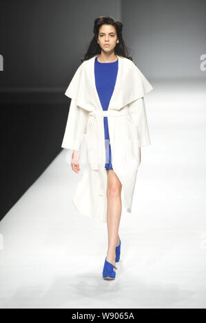 A model displays a creation by Russian designers Olga & Anna Kameneva ...