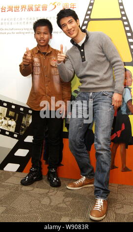 Taiwanese singer Leehom Wang, right, poses during the 50th Anniversary ...