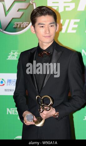 Chinese actor and singer Zhang Han or Hans Zhang arrives at an airport ...